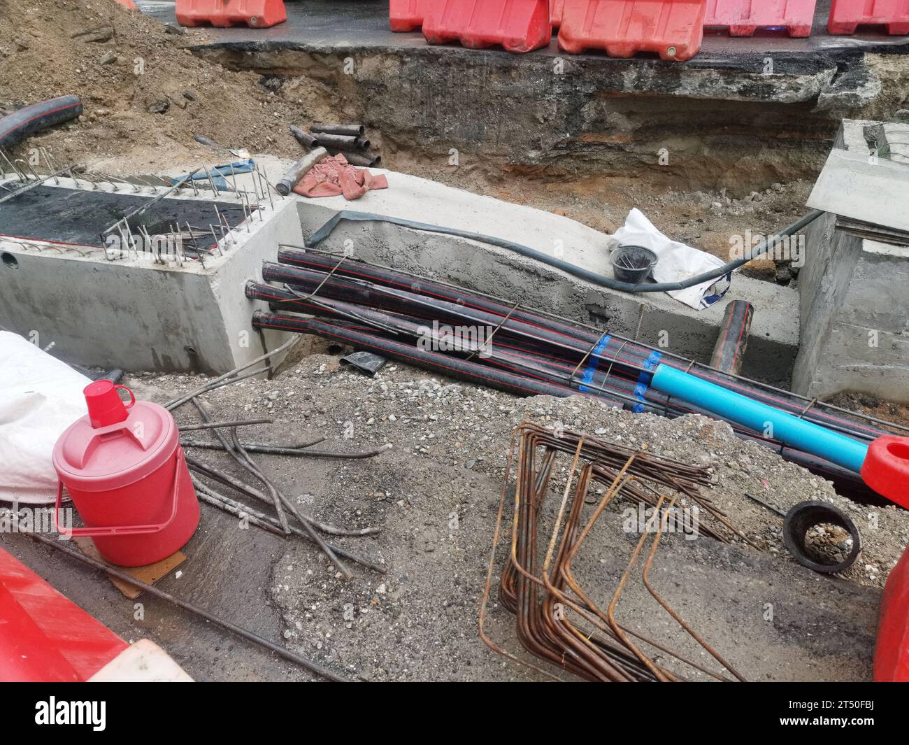 Pipes in the ground under asphalt Stock Photo - Alamy