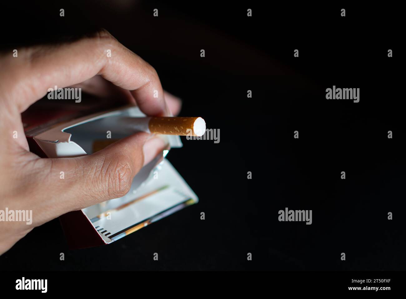 close up hand pick a cigarette from the pack Stock Photo - Alamy