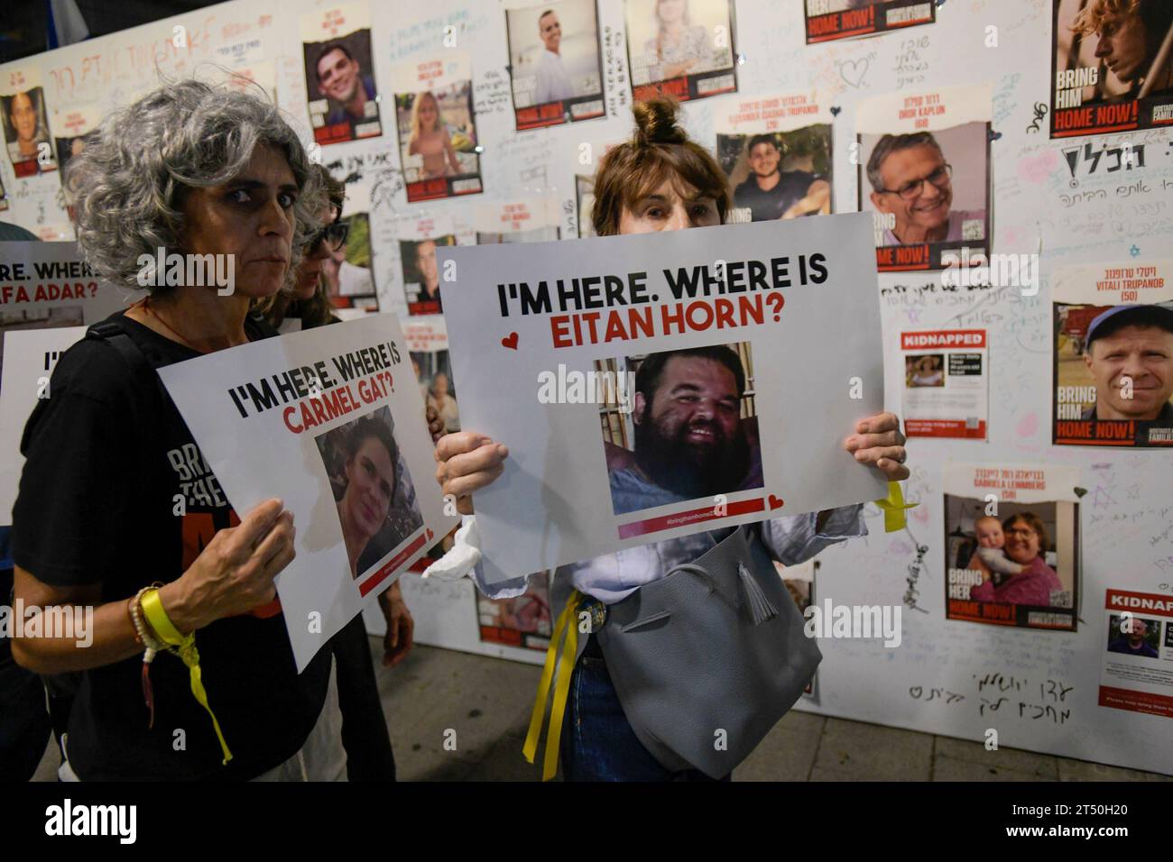 Tel Aviv, Israel. 01st Nov, 2023. A relative holds a portrait of Eitan Horn, who was kidnapped ...