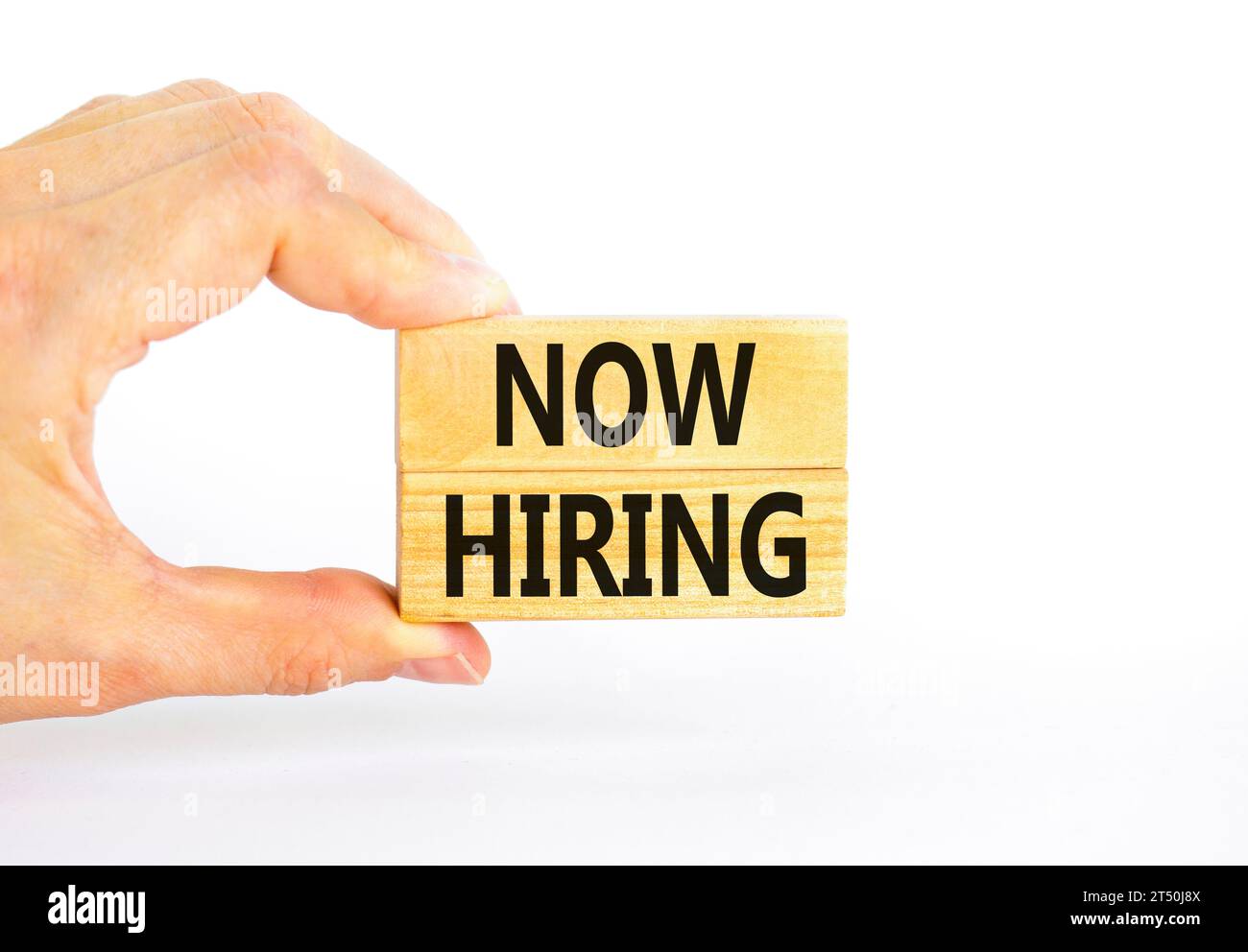 Now hiring symbol. Concept words Now hiring on beautiful wooden block ...