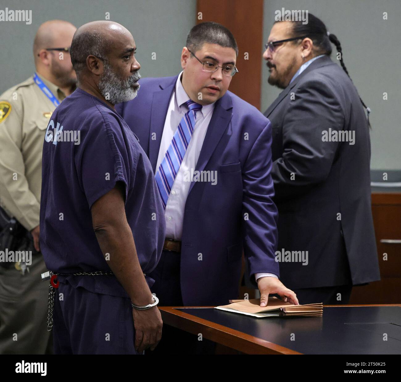 Duane Keith “Keffe D” Davis, left, with deputy special public defenders ...