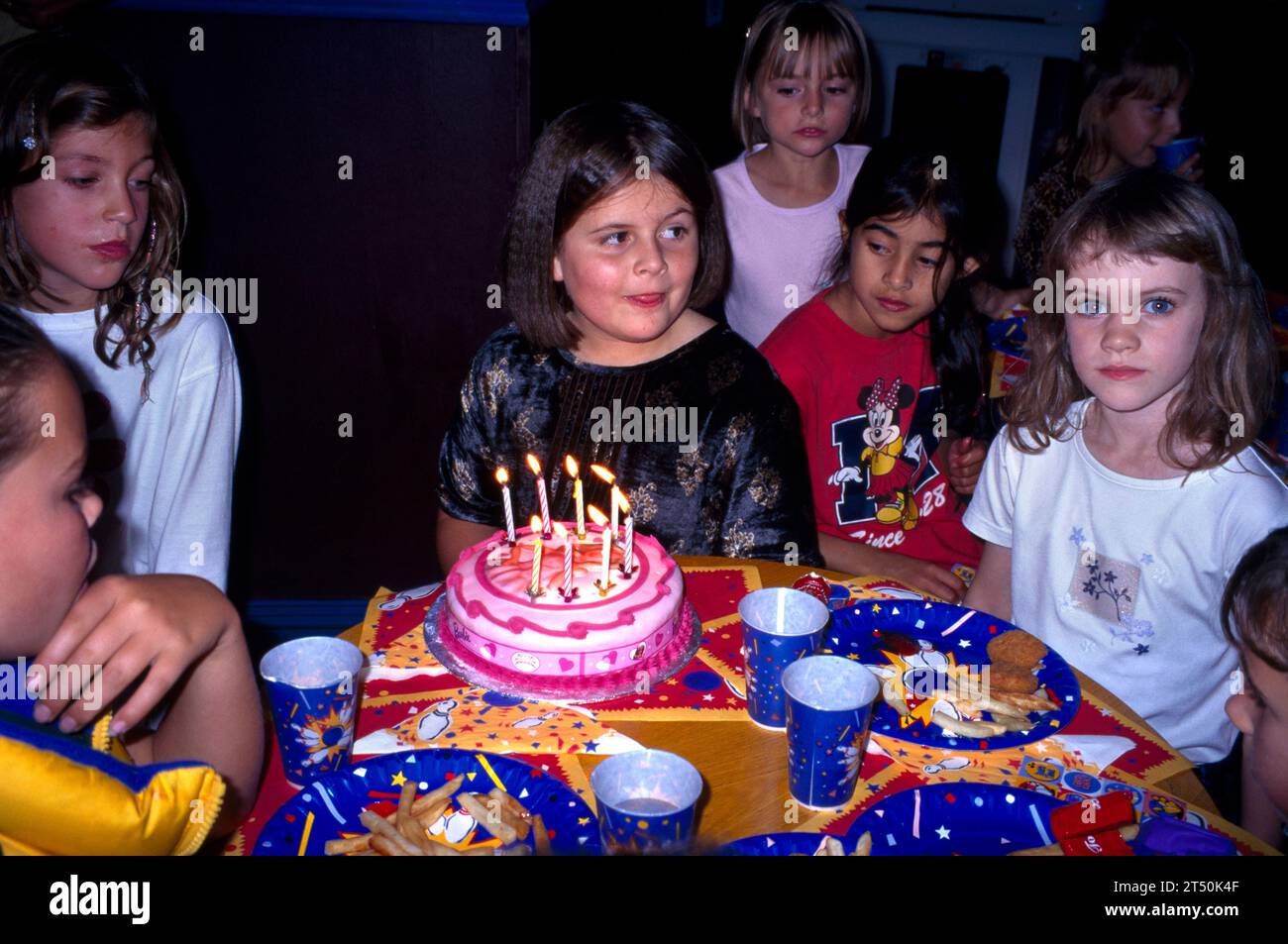 Girl Celebrating 8th Birthday with Friends at a Party Getting ready to ...