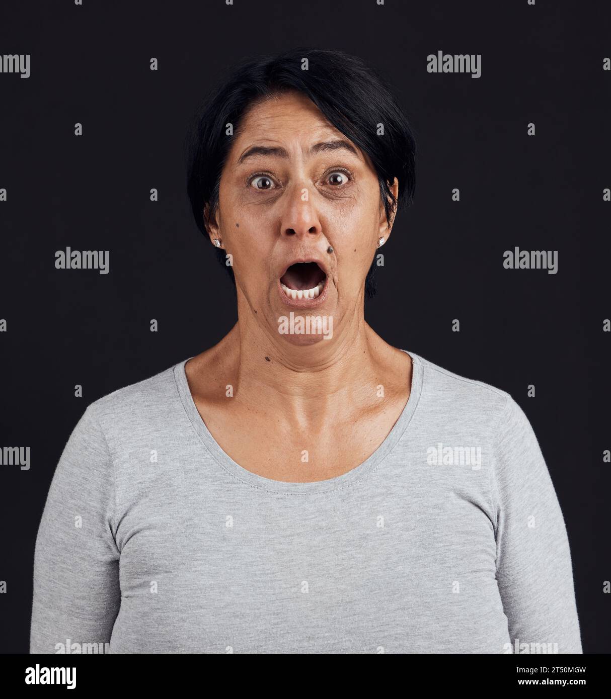 Portrait, screaming and senior woman with fear, shocked and news with ...