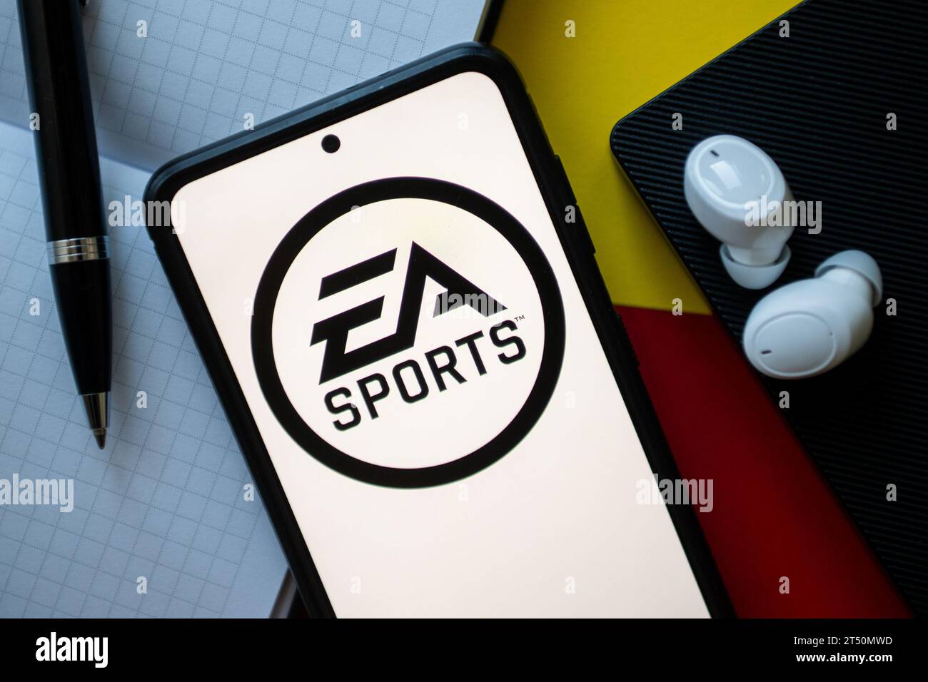 In this photo illustration an EA Sports logo seen displayed on a ...
