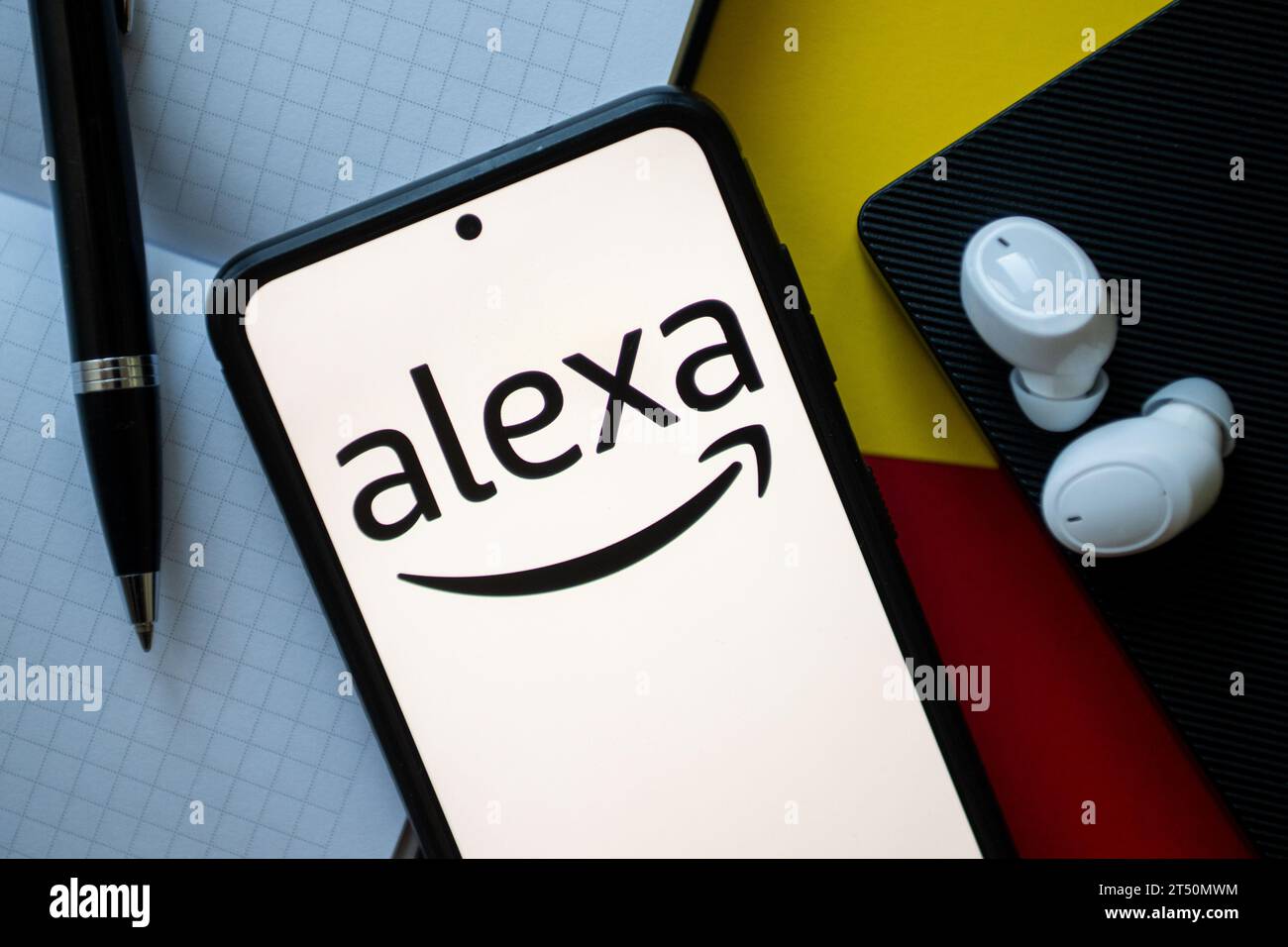 In this photo illustration an Alexa logo seen displayed on a smartphone ...