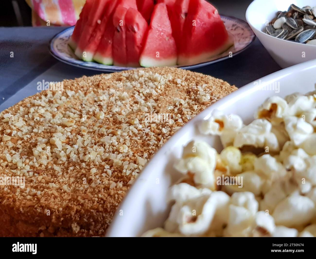 happy birthday table consist of cake popcorn watermelons and nuts Stock ...