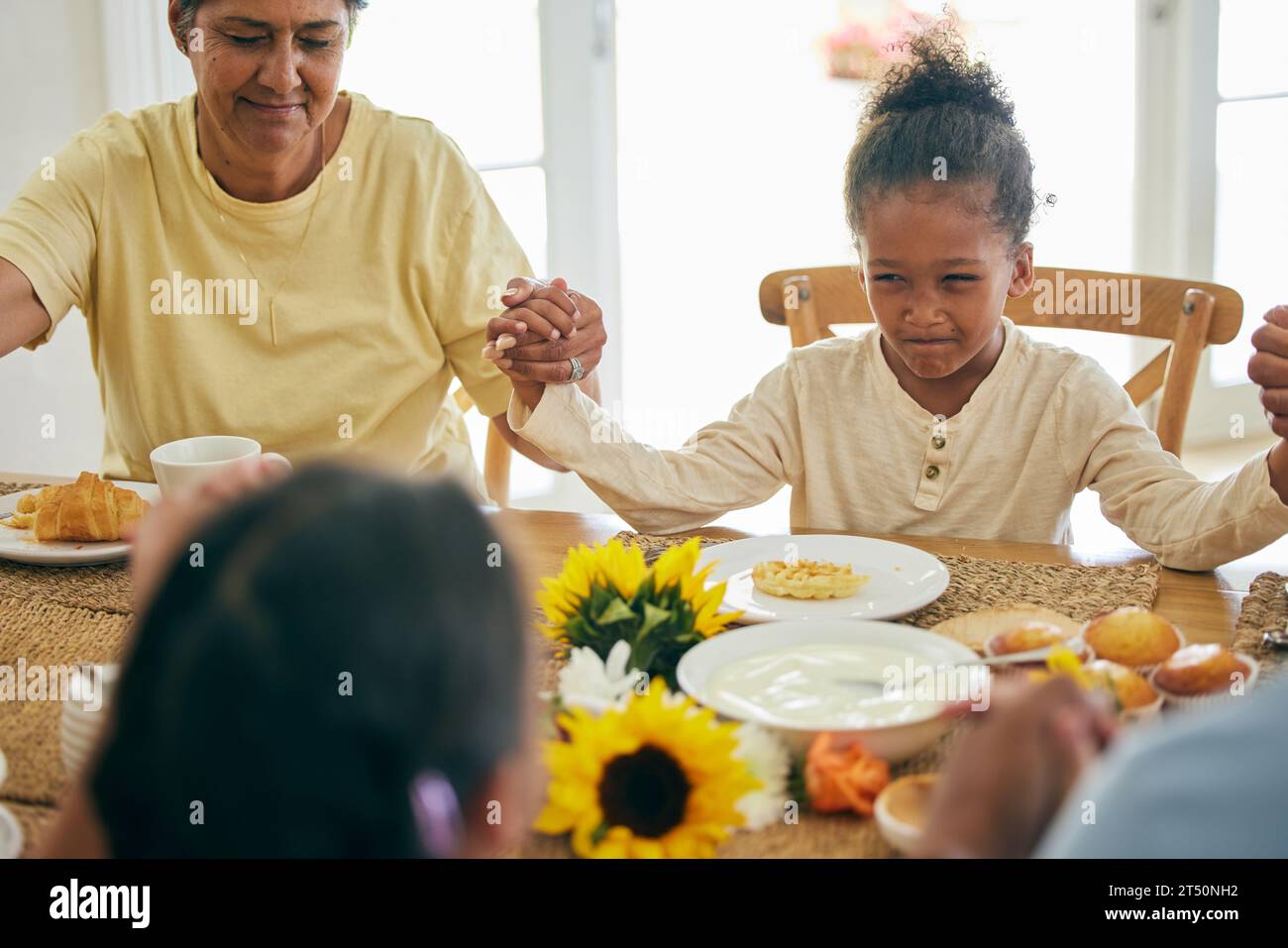Praying, parents and child holding hands for lunch, dinner or breakfast ...