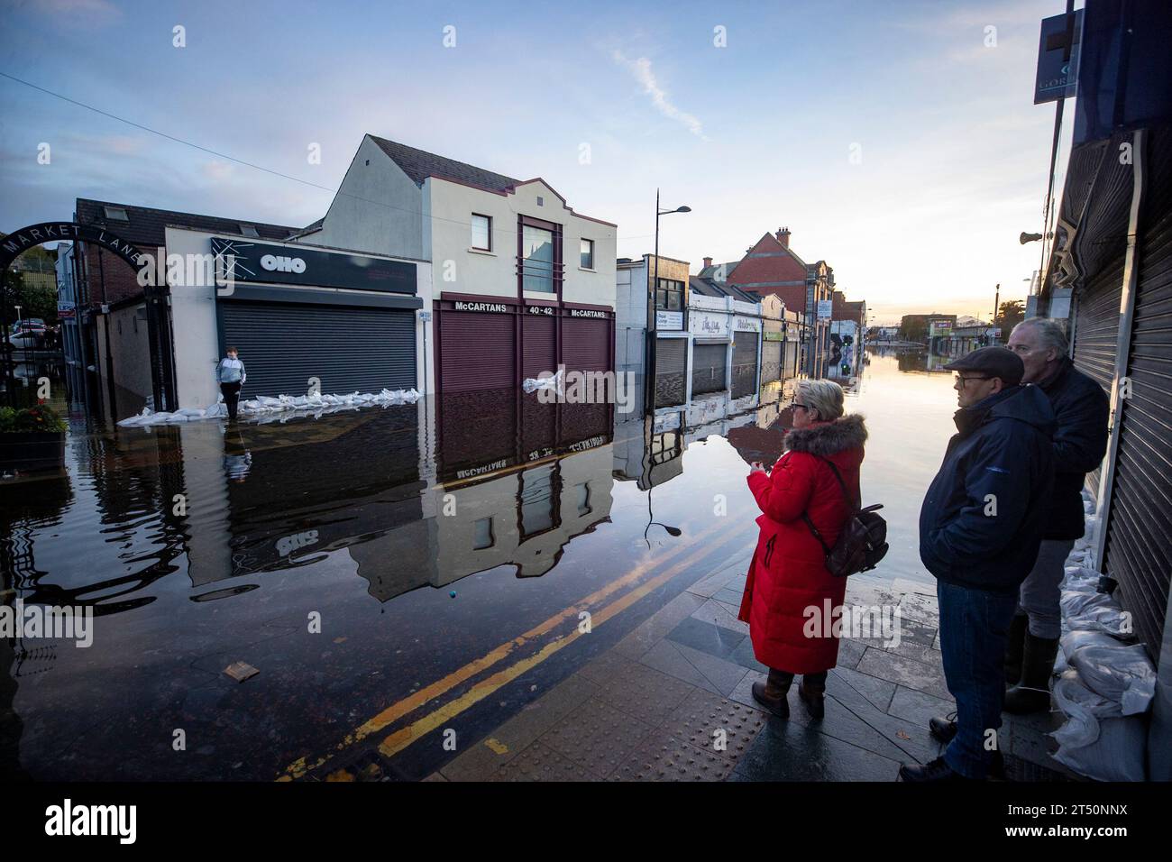 People look at the flooding on Market Street in Downpatrick, Northern ...