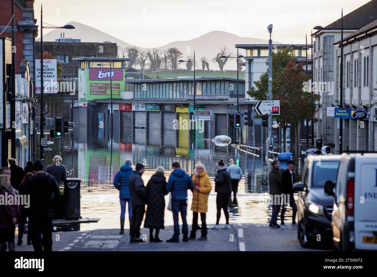 People look at the flooding on Market Street in Downpatrick, Northern ...