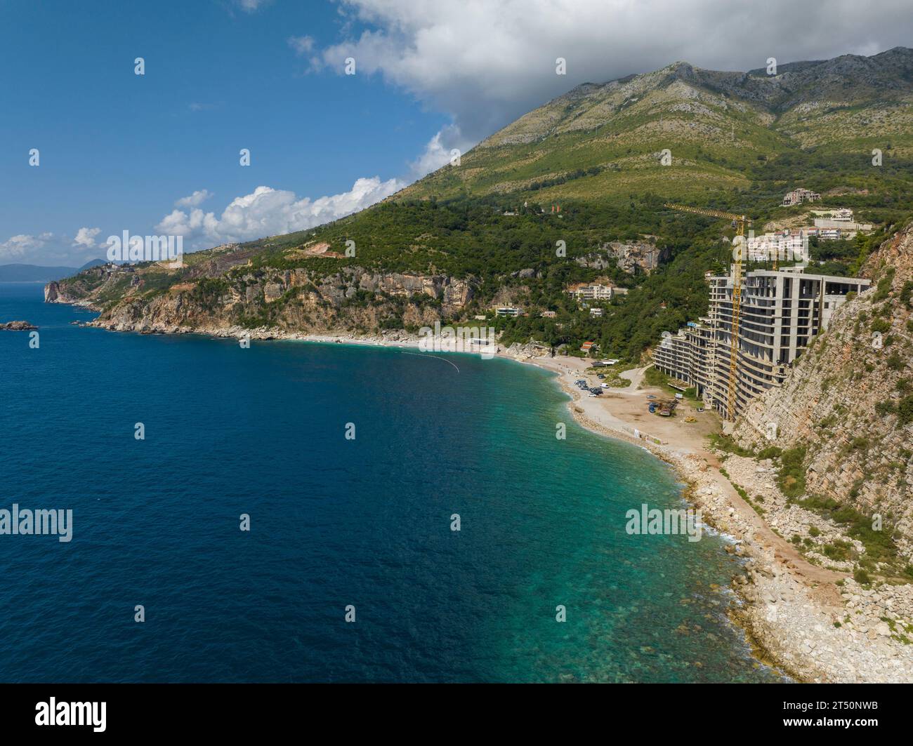 Aerial of Abandoned Hotel. Building cranes near the beach Perazica Do ...