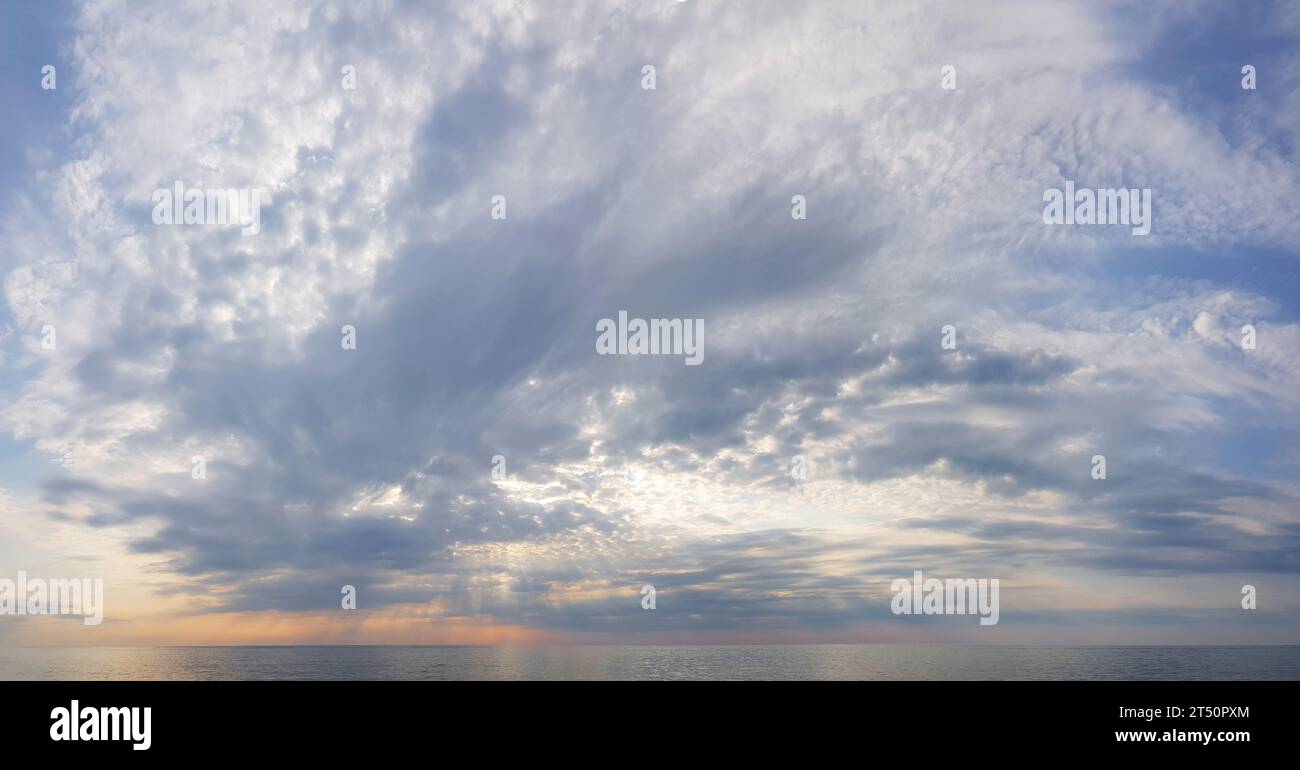 Colorful dinamic sunset sky with clouds above sea beach background ...