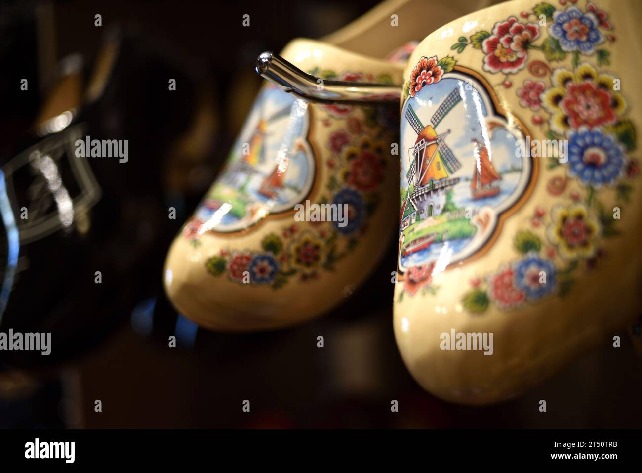 A close-up of a traditional Dutch wooden clog, with intricate details ...