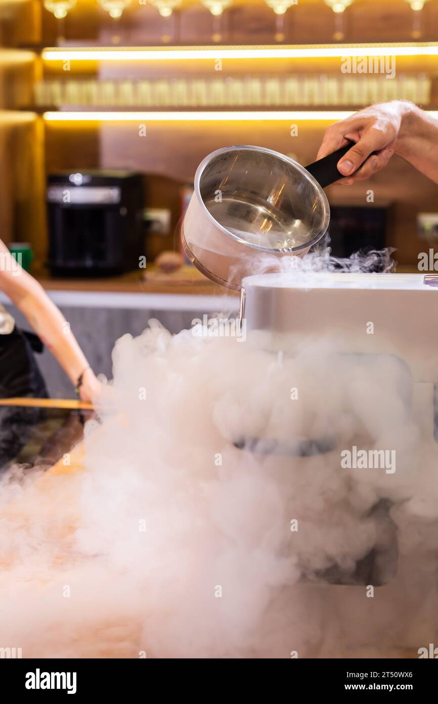 Smoke vapor dry ice in bowl in kitchen Stock Photo - Alamy