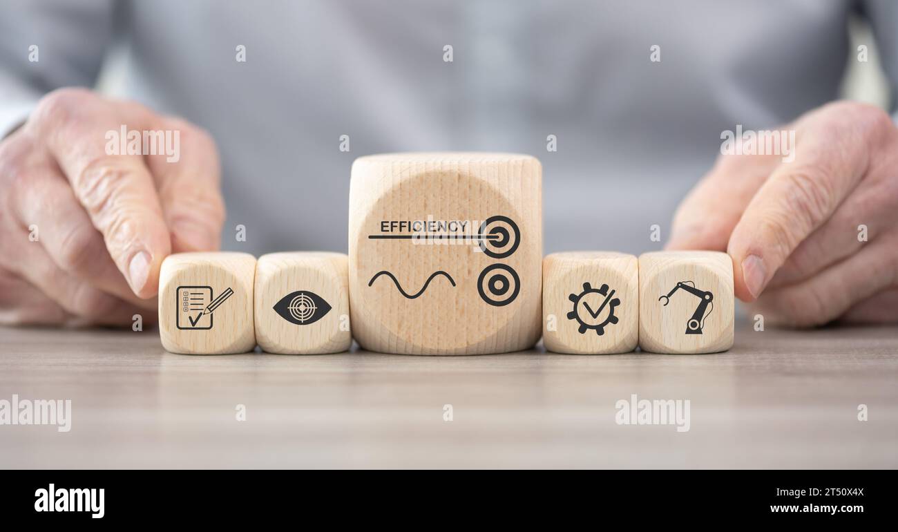 Wooden blocks with symbol of efficiency concept Stock Photo - Alamy