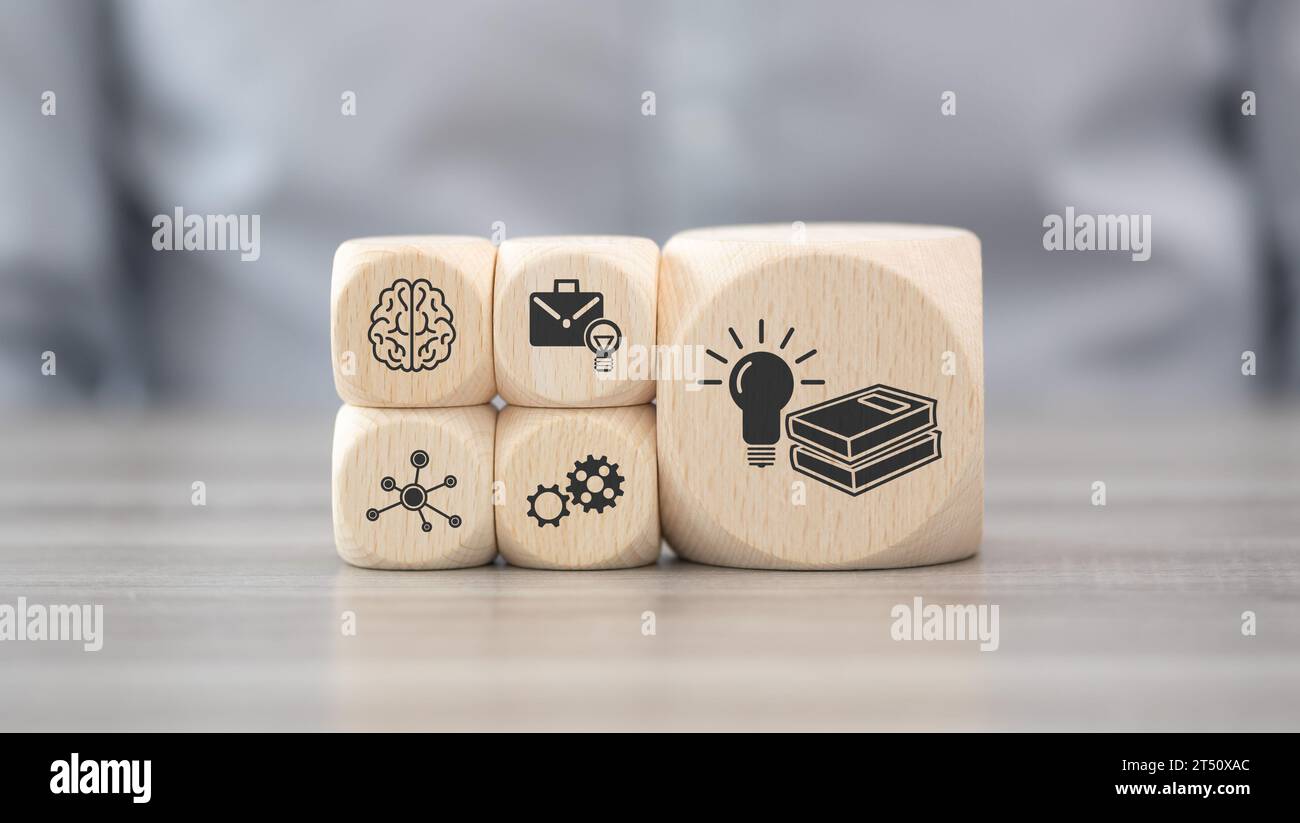 Wooden blocks with symbol of knowledge concept Stock Photo - Alamy
