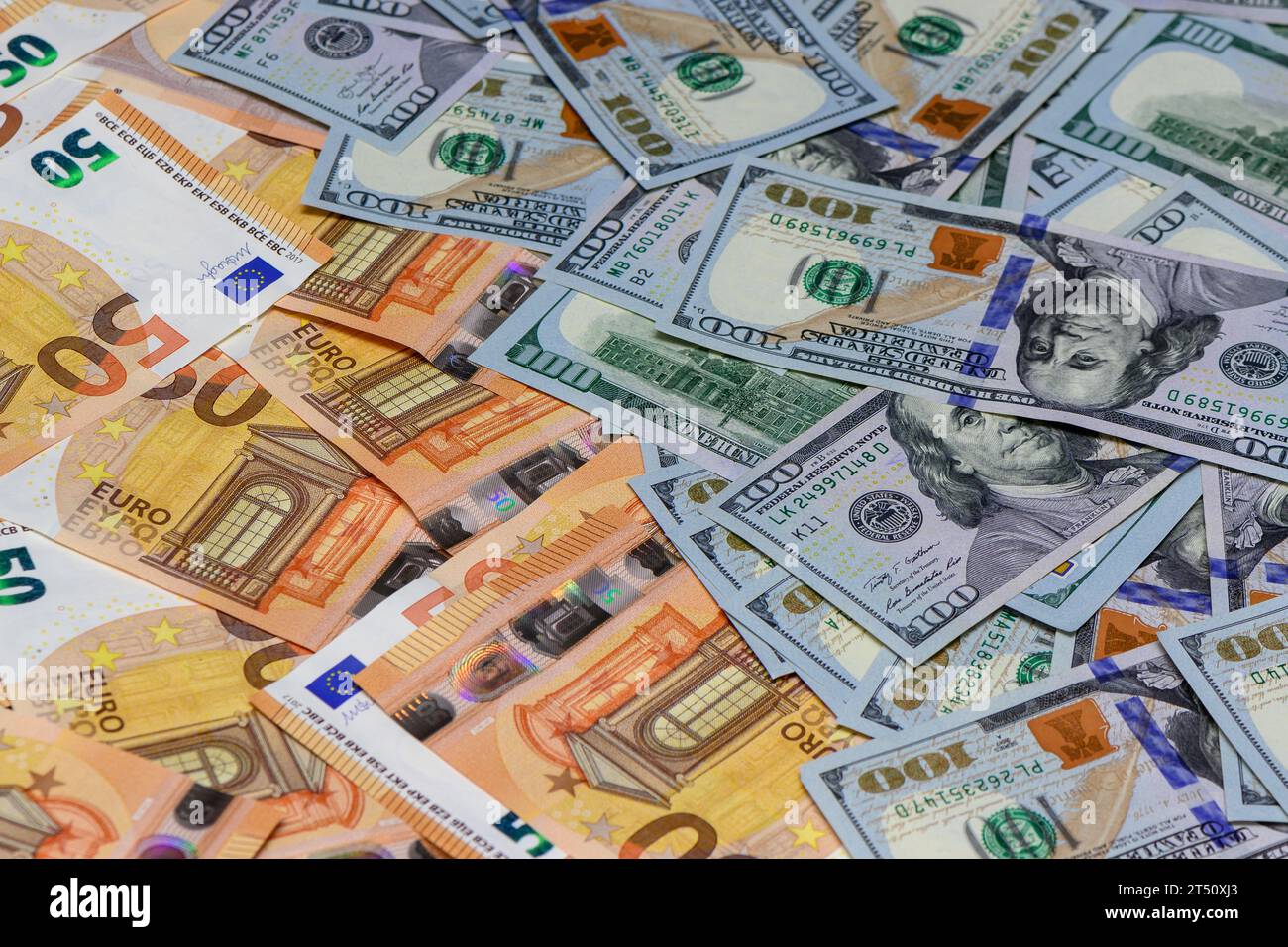 50 euro and 100 dollar bills mixed on the table, studio filming 6 Stock ...