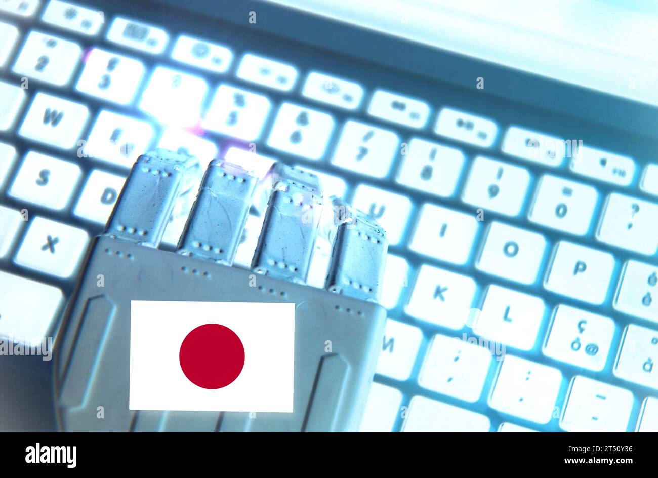Robotic hand typing on a keyboard with the Japanese Flag. Concept of ...