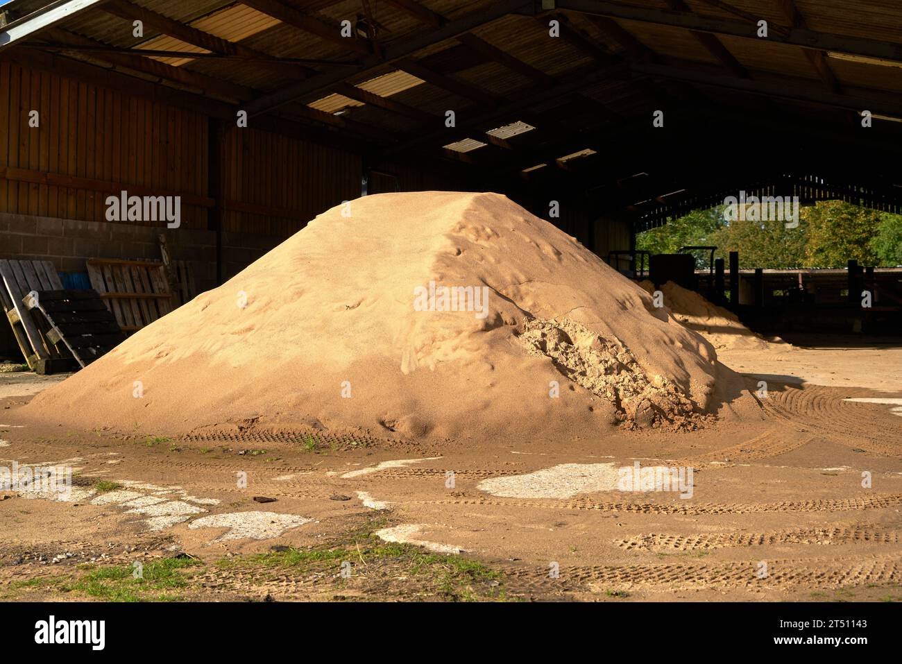 Pile of sand outside a barn Stock Photo - Alamy