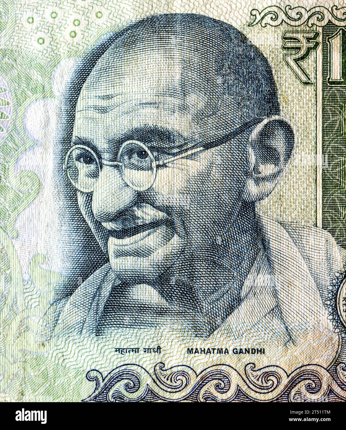 Mahatma Gandhi (1869-1948). Portrait from indian rupee banknote close ...