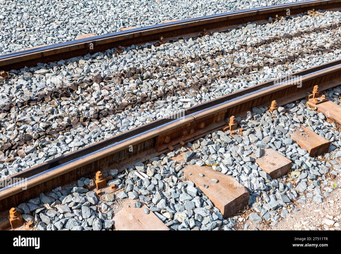 Laying new tram rails on wooden sleepers. Repair of railway tracks and tram lines. Concept photo ...