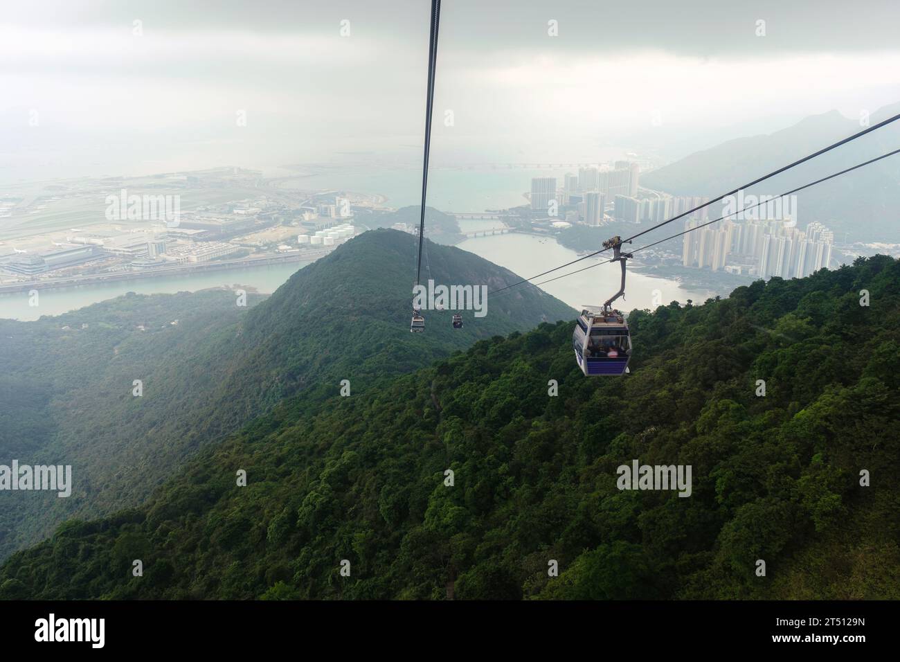 View from Nhong Ping 360 cable car crossing over the mountain in Tung ...