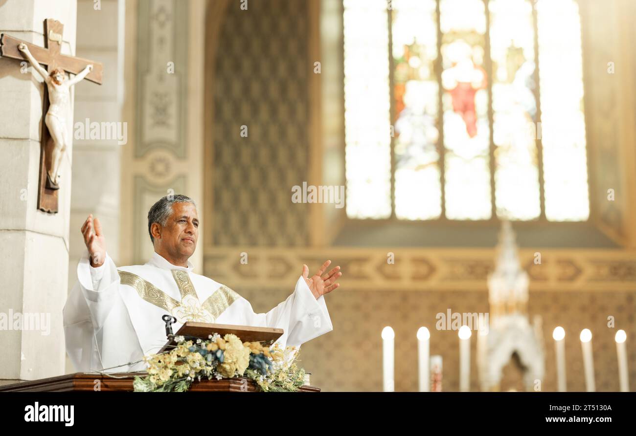 Religion, Christianity and priest speaking in church with arms raised ...