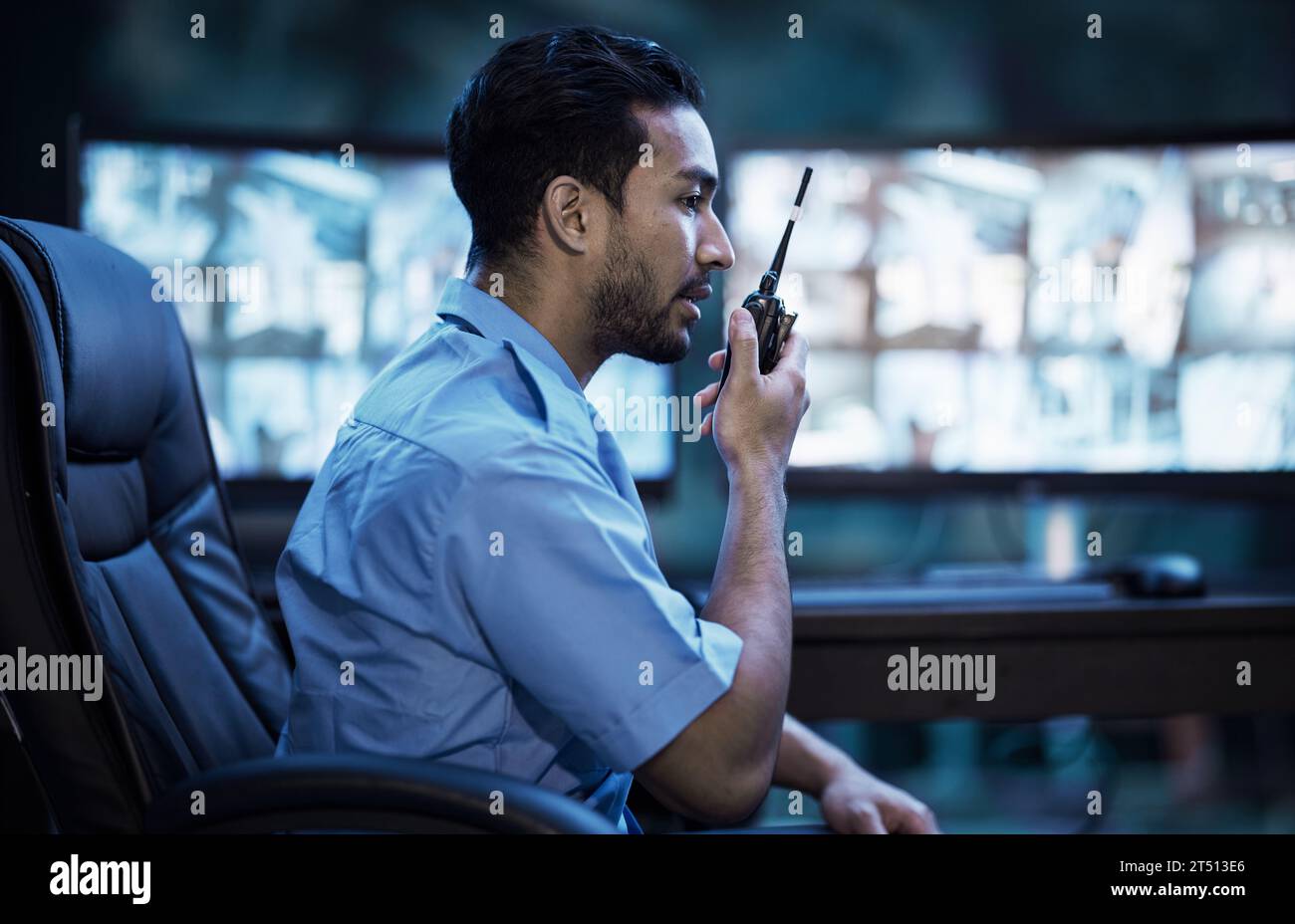 Security guard in control room, man with radio and screen to check cctv ...