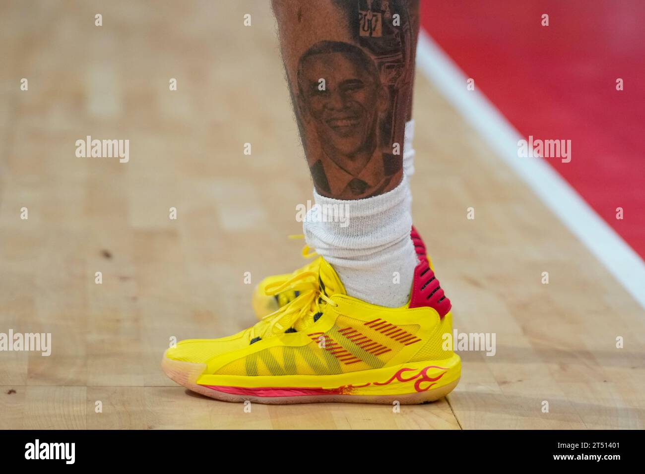 A tattoo depicting former U.S. President Barack Obama is seen on left ...