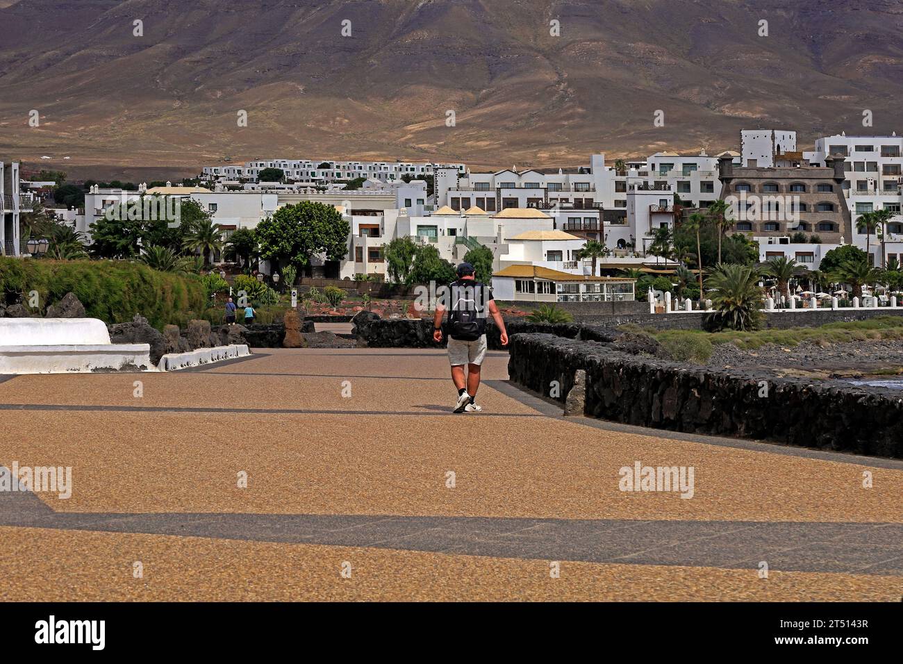 Man walking on coastal path from Playa Blanca to Las Coloradas ...