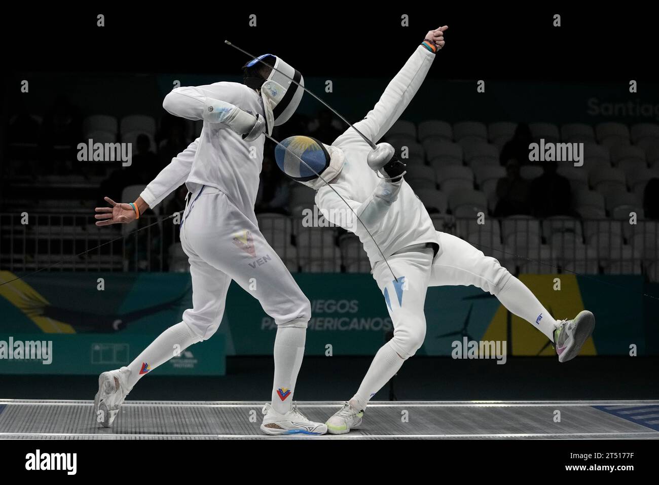 Venezuela's Eduardo Lugo, left, faces Argentina's Adolfo Gusman during ...