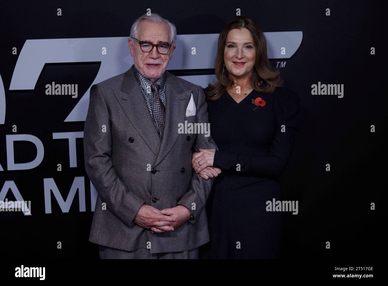 Brian Cox, left, and producer Barbara Broccoli poses for photographers ...