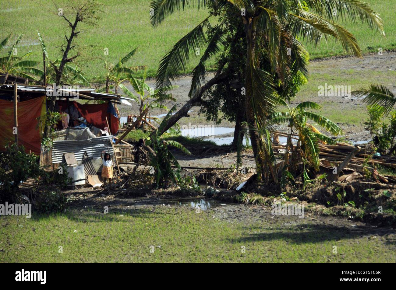 0806264009P-013 AKLAN, Philippines (June 26, 2008) A girl waves in ...