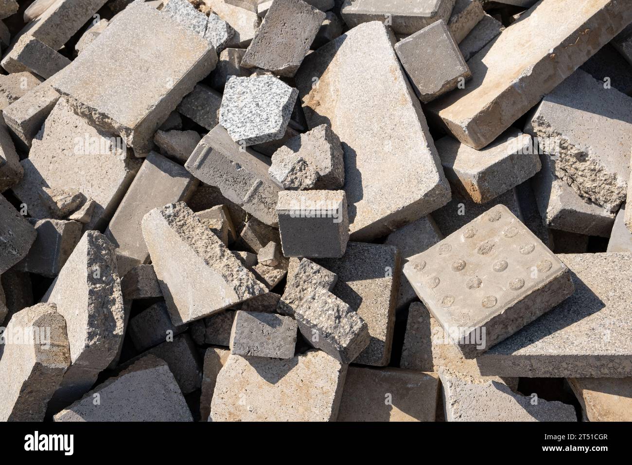 Shattered and broken street tiles, remnants of construction waste ...