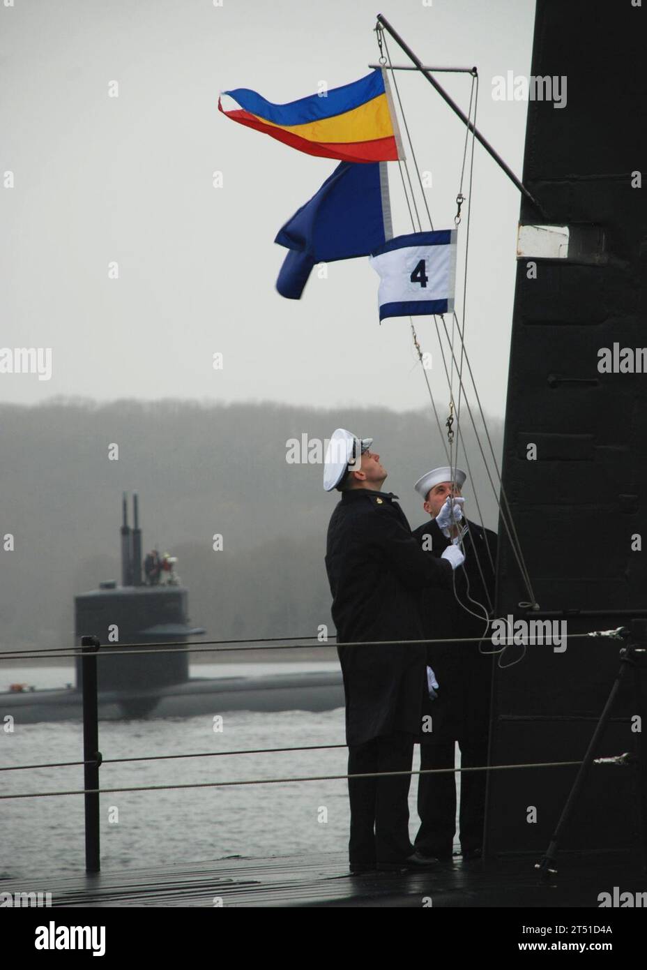 1004093090M-330 GROTON, Conn. (April 9, 2010) Sailors lower the ...