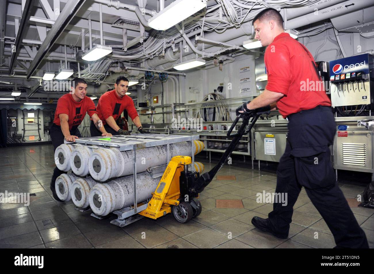 110721AU622-176 ATLANTIC OCEAN (July 21, 2011) Sailors move ordnance on ...