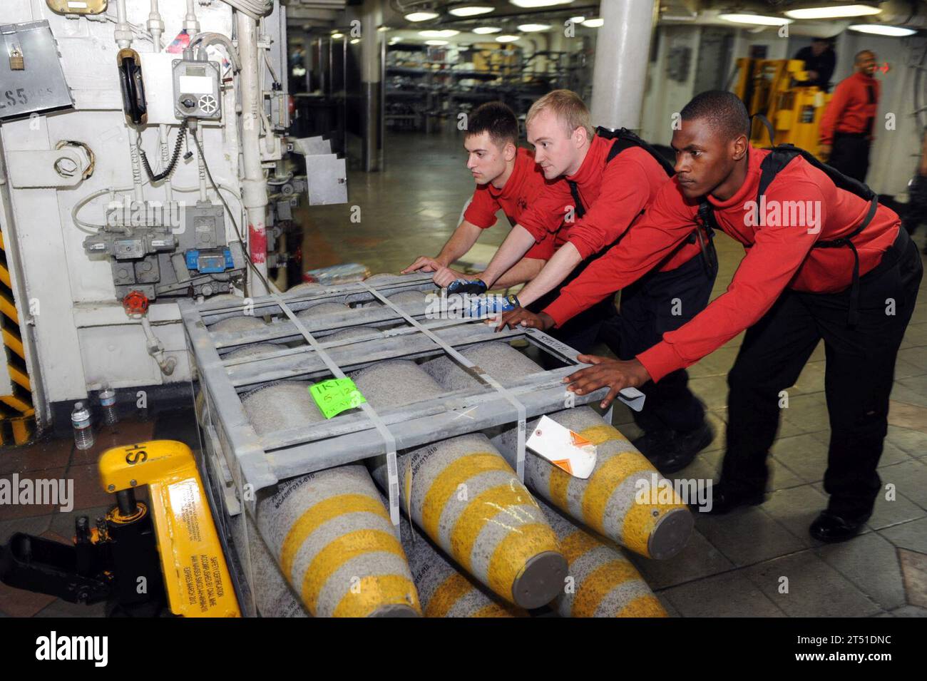110721AU622-082 ATLANTIC OCEAN (July 21, 2011) Sailors move ordnance on ...