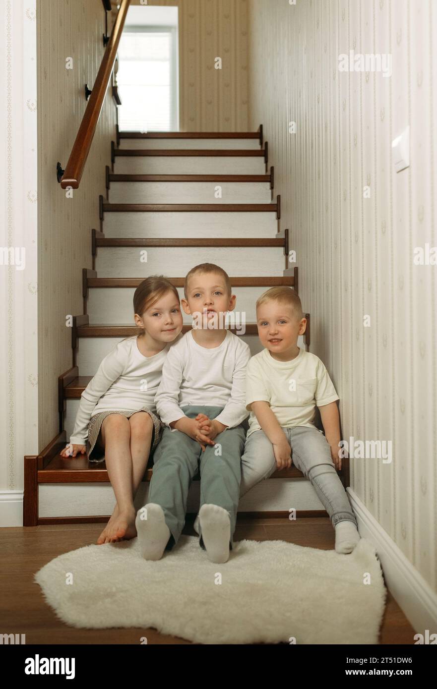 Two sisters sitting on stairs hi-res stock photography and images - Alamy