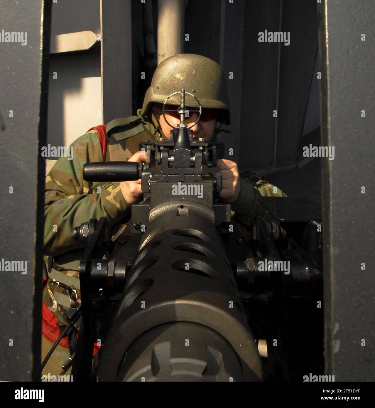 .50-caliber machine gun, aircraft carrier, checks sights, Pacific Ocean ...