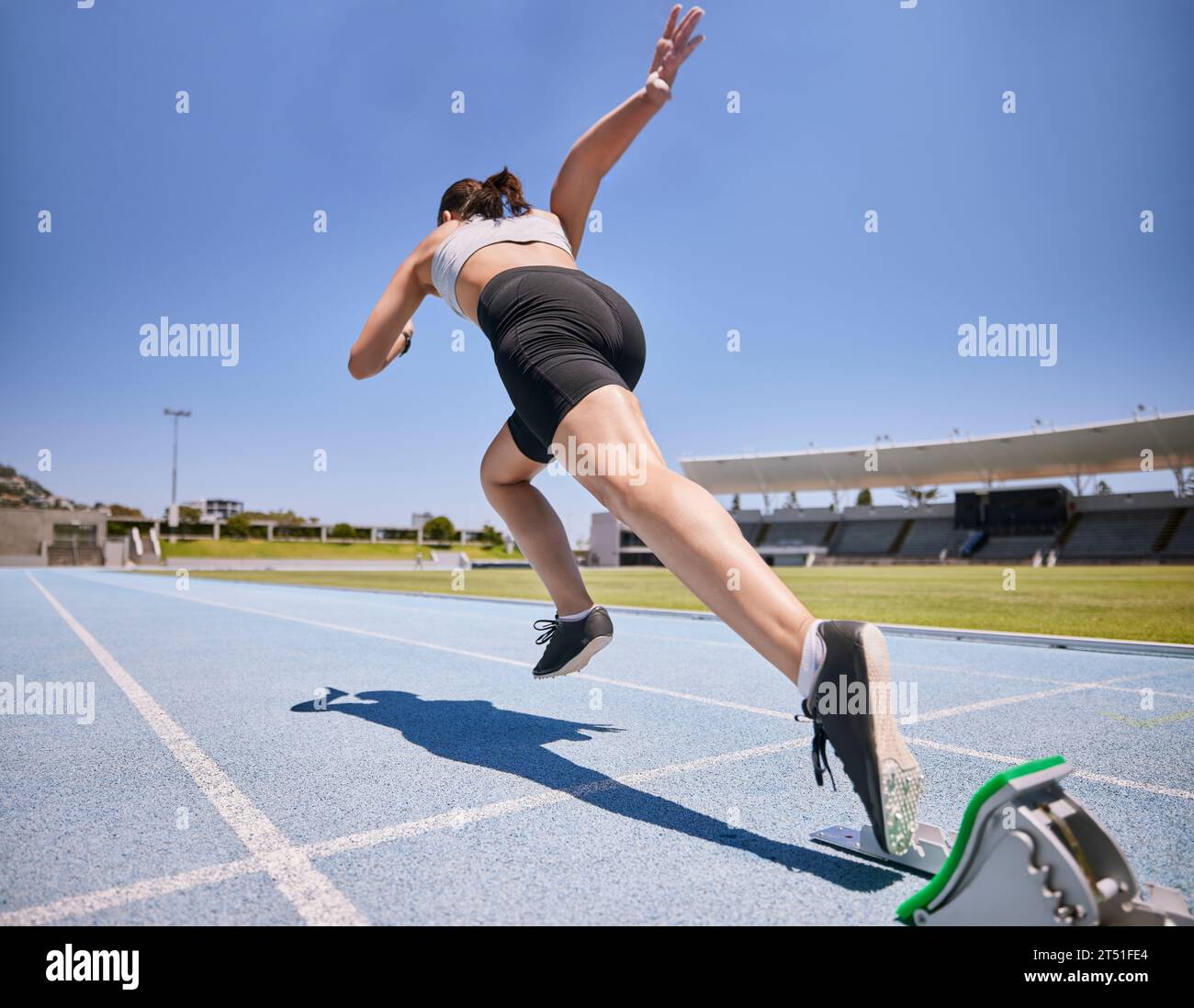 Woman track runner, start running and sprint training for race exercise ...