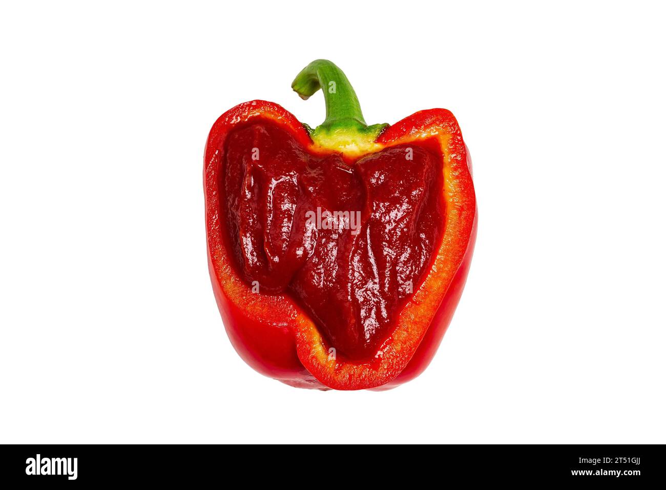 Red bell pepper cut in half, season inside with ketchup close-up on a ...