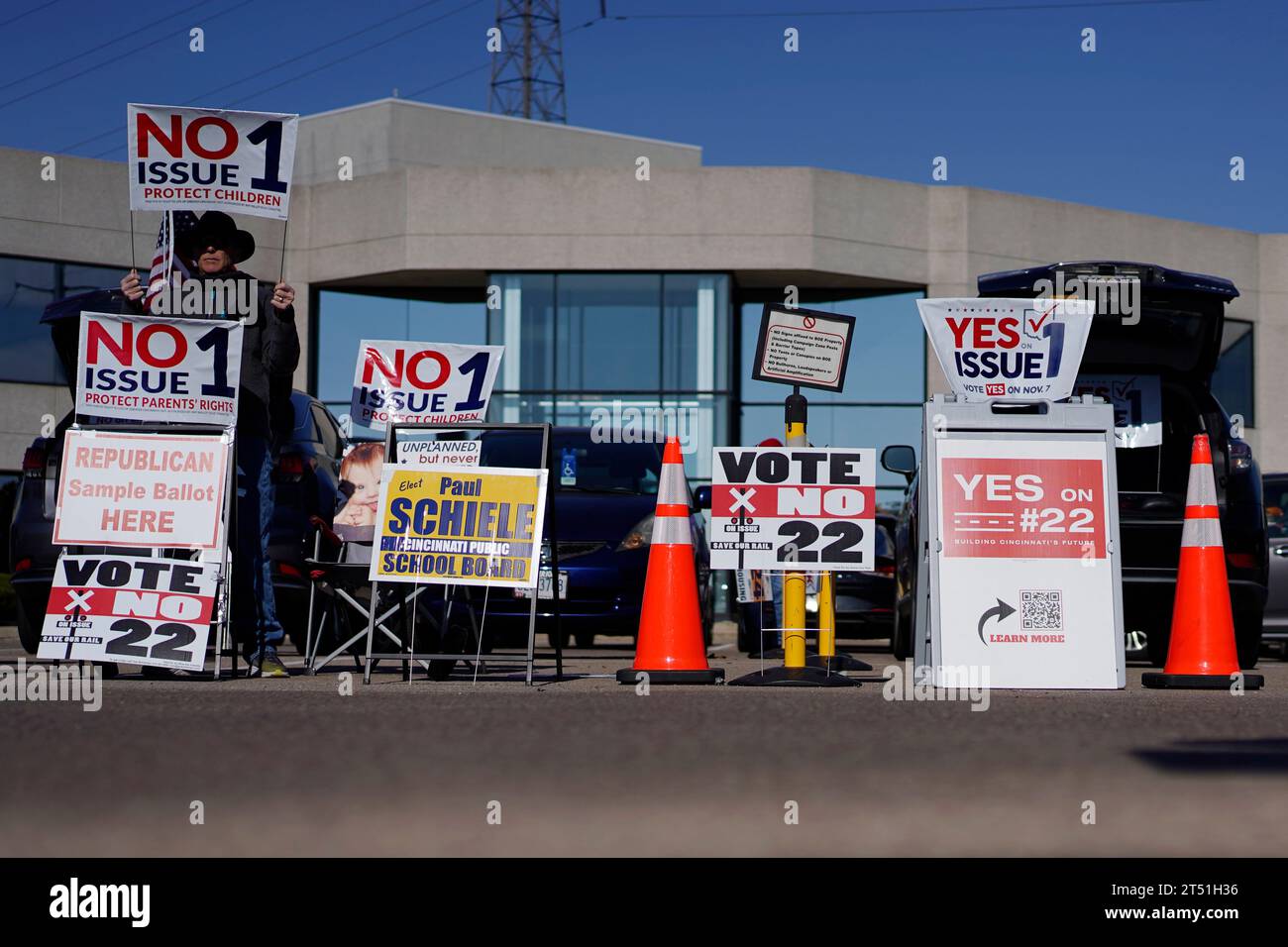 People gather in the parking lot of the Hamilton County Board of ...
