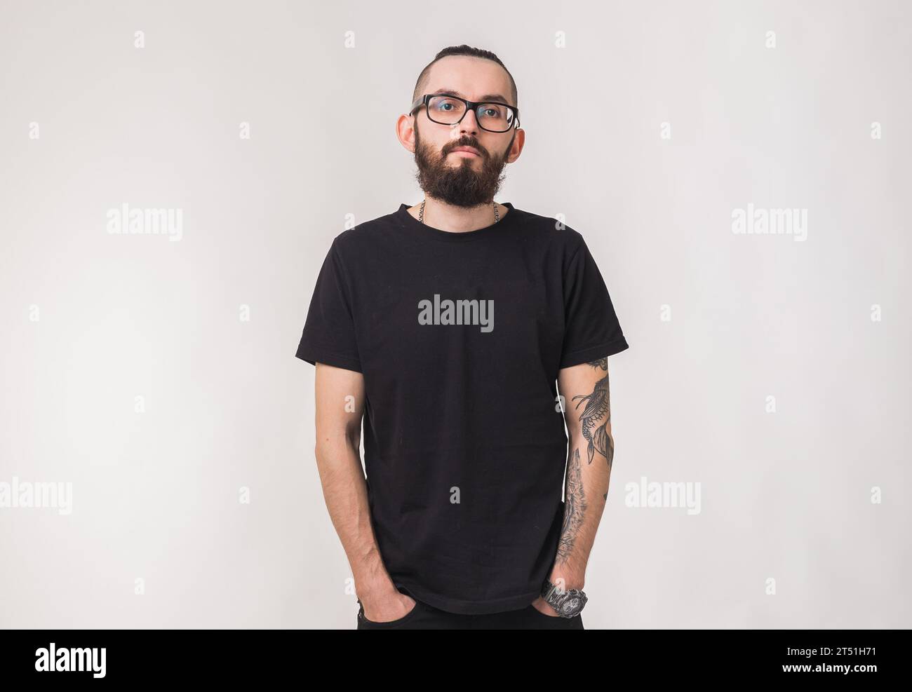 Portrait of attractive handsome man millennial with beard who looks ...