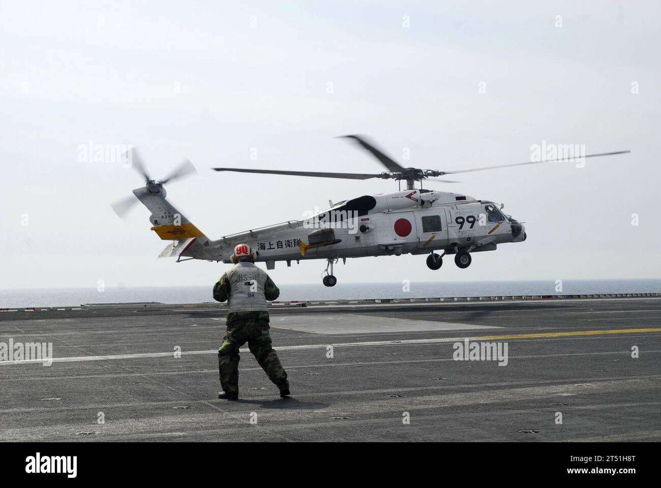 110313GL340-119 PACIFIC OCEAN (Mach. 13, 2011) An SH-70B helicopter ...