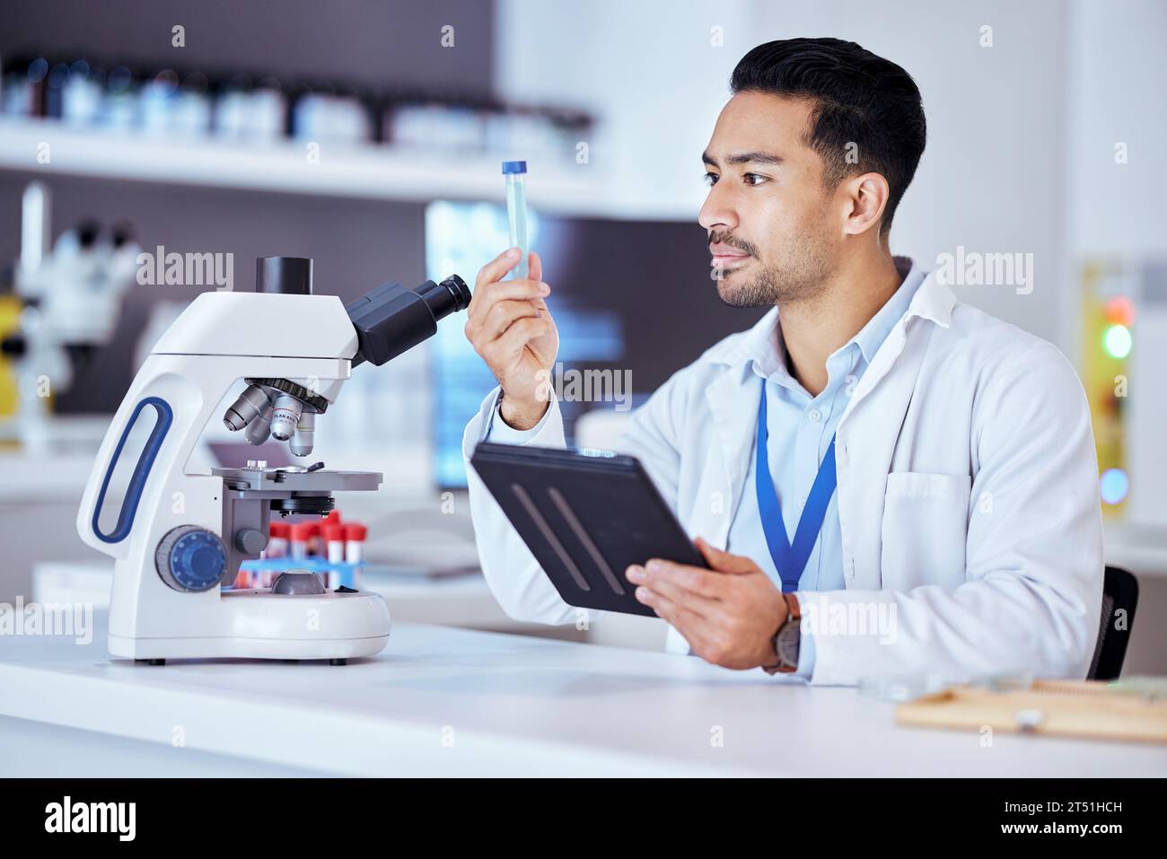 Science, microscope and man with sample and tablet in laboratory for ...