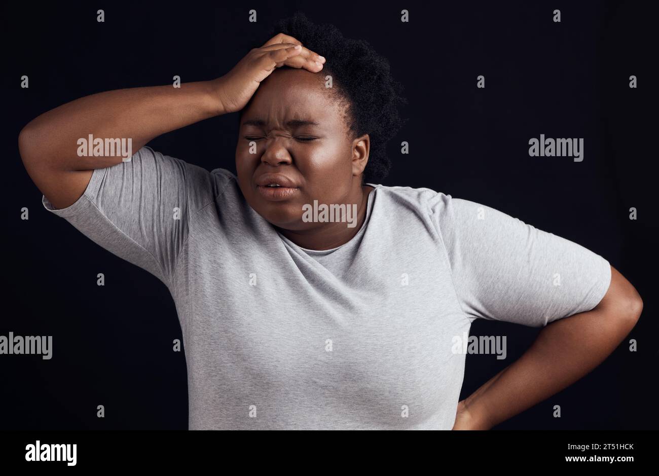 Frustrated black woman, headache and anxiety in studio of stress ...