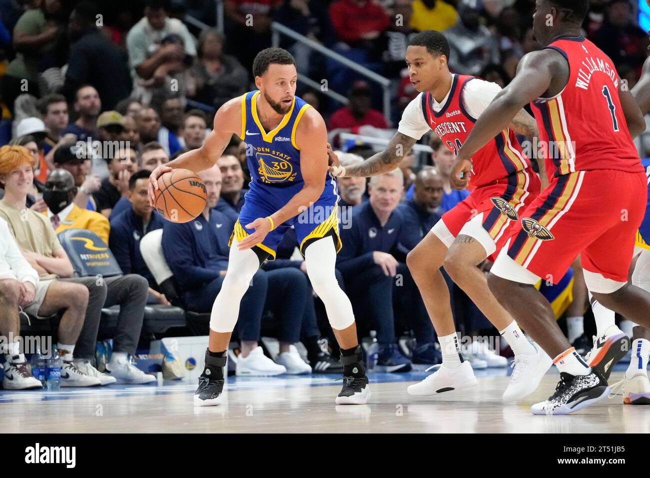 Golden State Warriors guard Stephen Curry (30) works the ball against New Orleans Pelicans guard ...