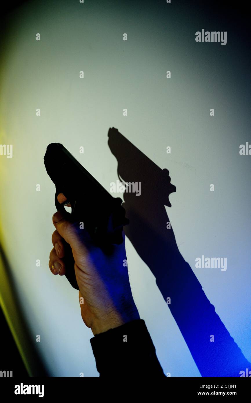 Pistol gun artistic photograph book cover design Stock Photo - Alamy