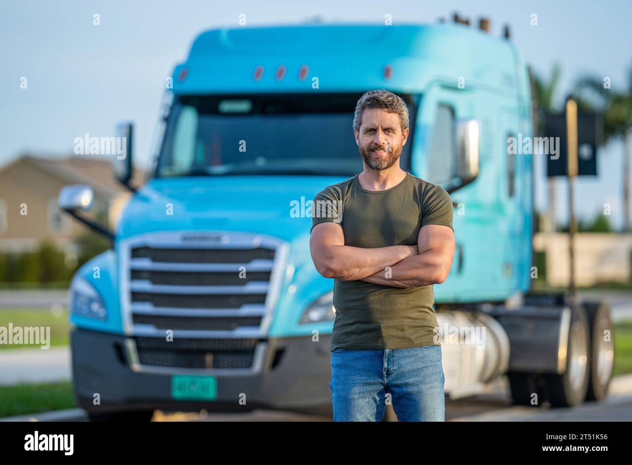 hispanic man owner truck driver near lorry semi vehicle Stock Photo - Alamy