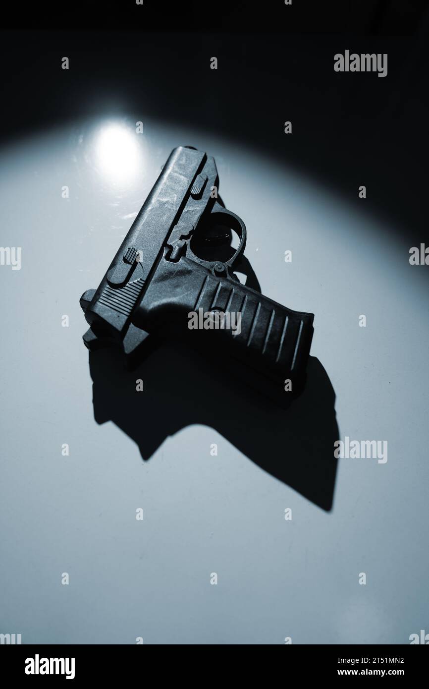 Pistol gun artistic photograph book cover design Stock Photo - Alamy