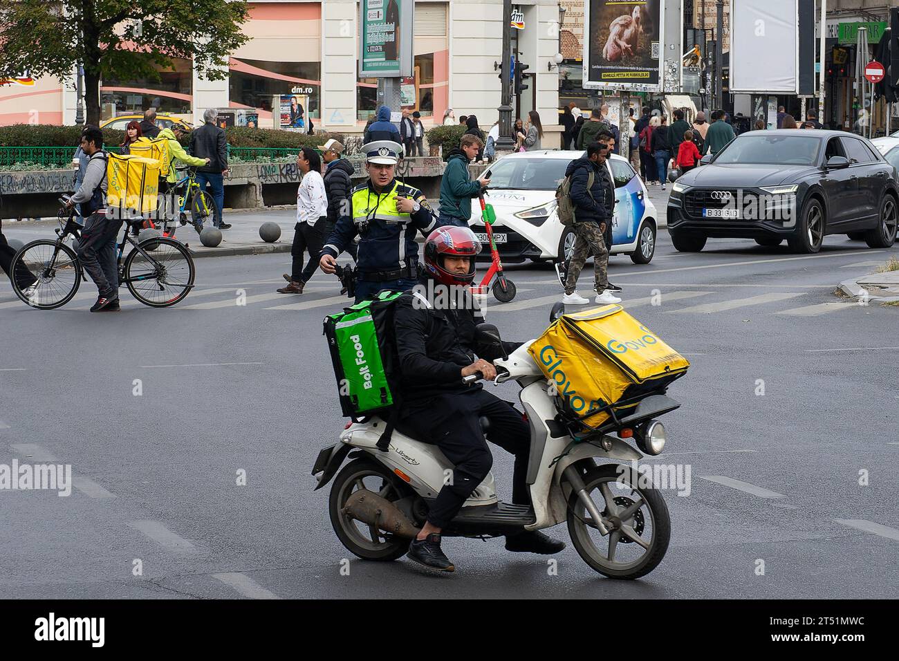 Bucharest, Romania. 2st Nov, 2023: A food delivery courier carrying ...